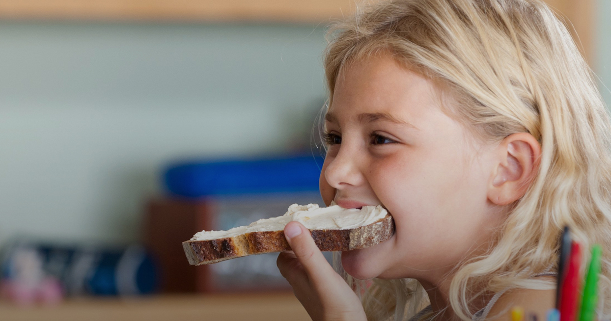 Woman Eating Block Of Cheese